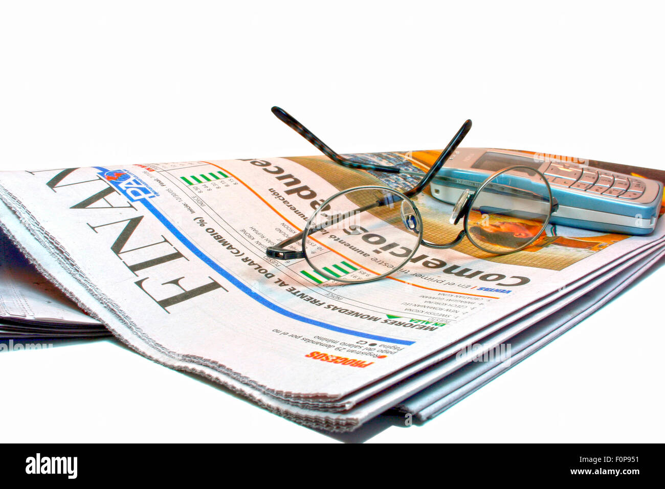 Business newspaper with glasses and cell phone on it Stock Photo - Alamy
