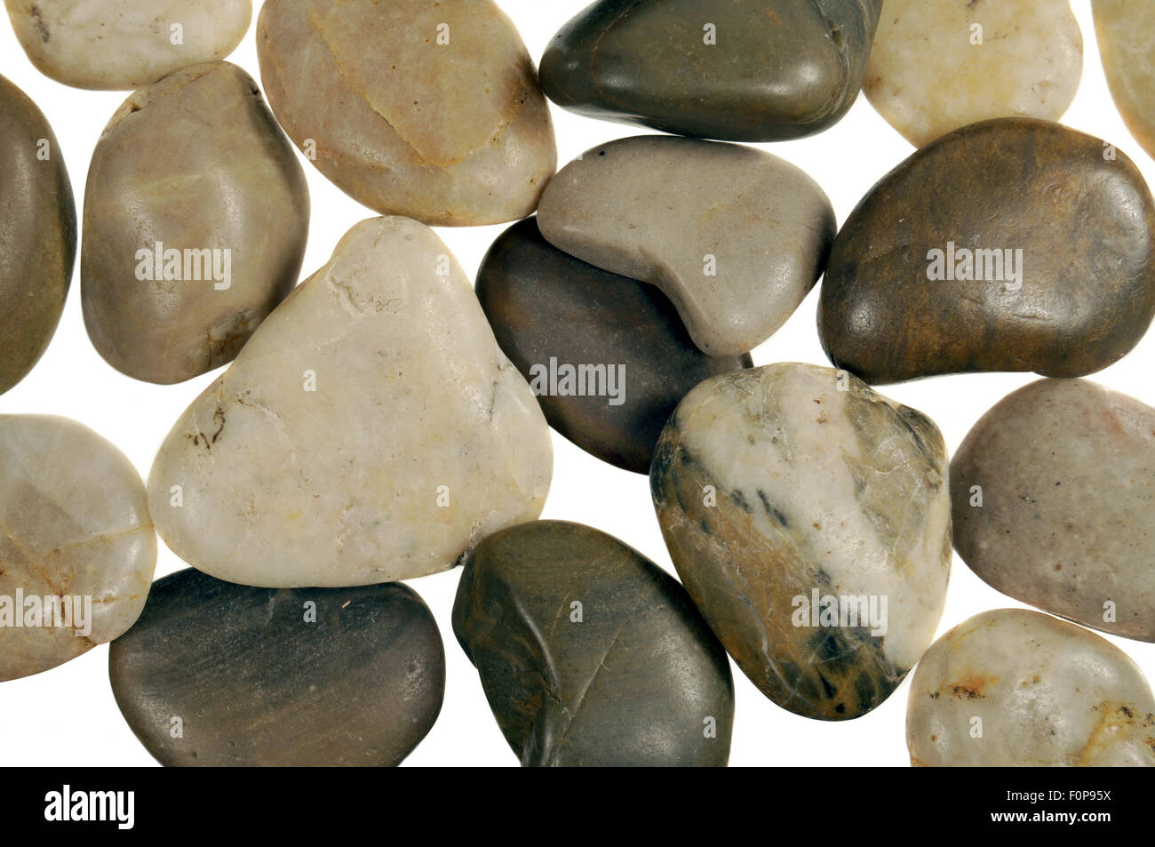 Bunch of small zen stones with a white background Stock Photo - Alamy