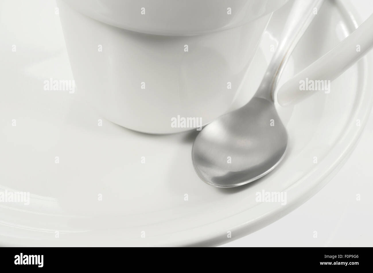 White coffeemug and spoon Stock Photo - Alamy