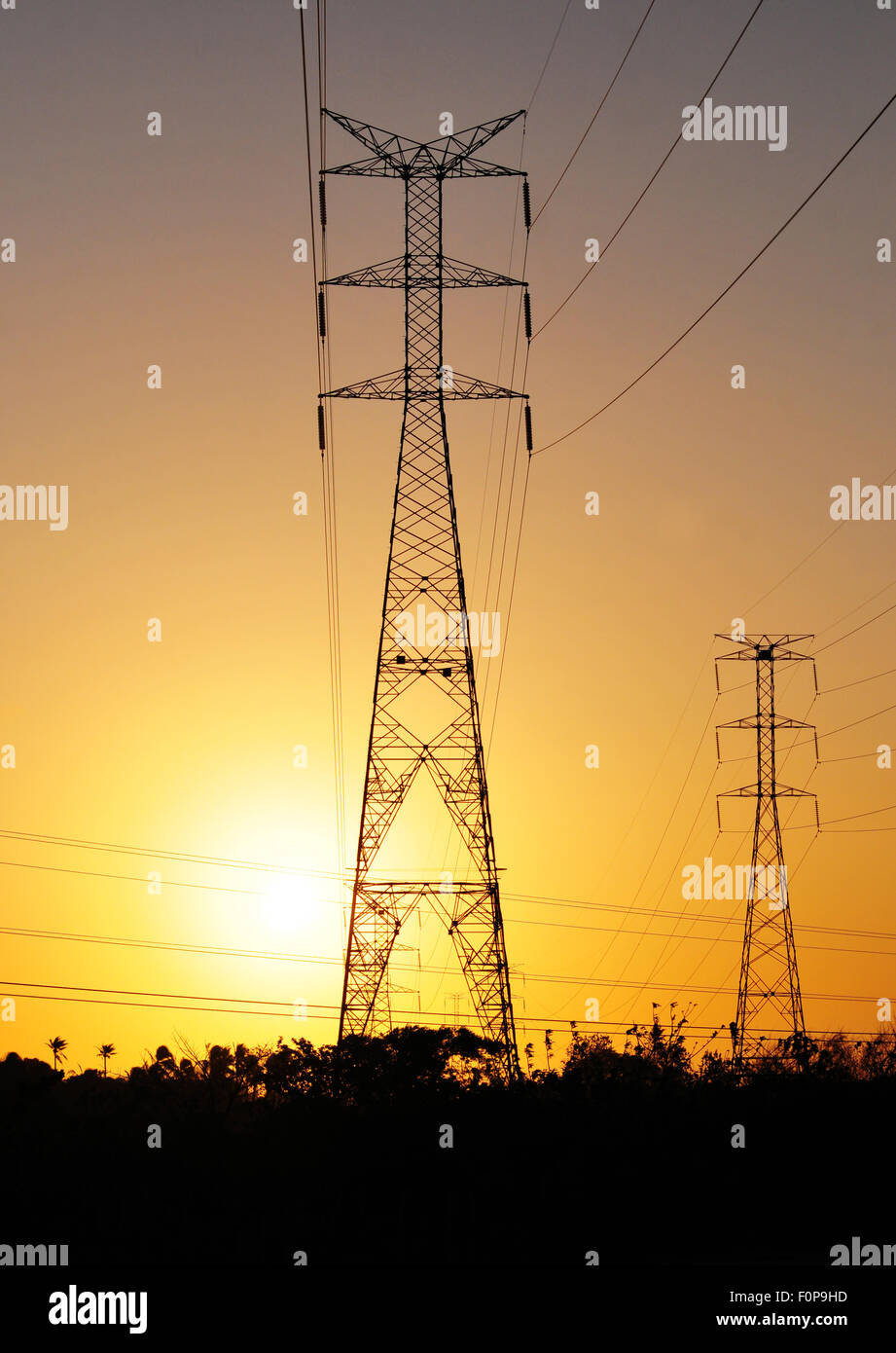Power line towers at sunrise Stock Photo - Alamy