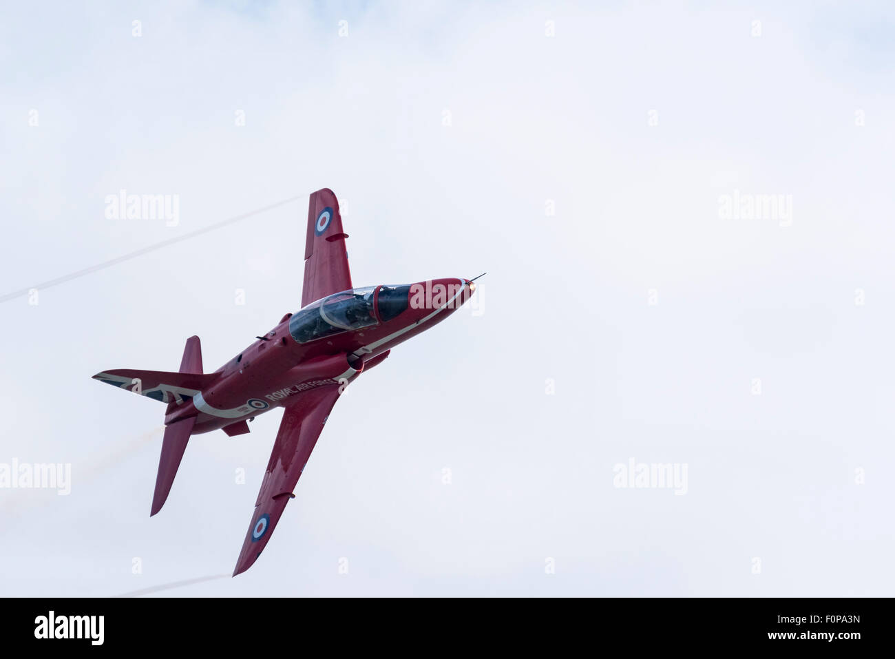 A single Red Arrow turning and flying almost directly overhead. Taken ...