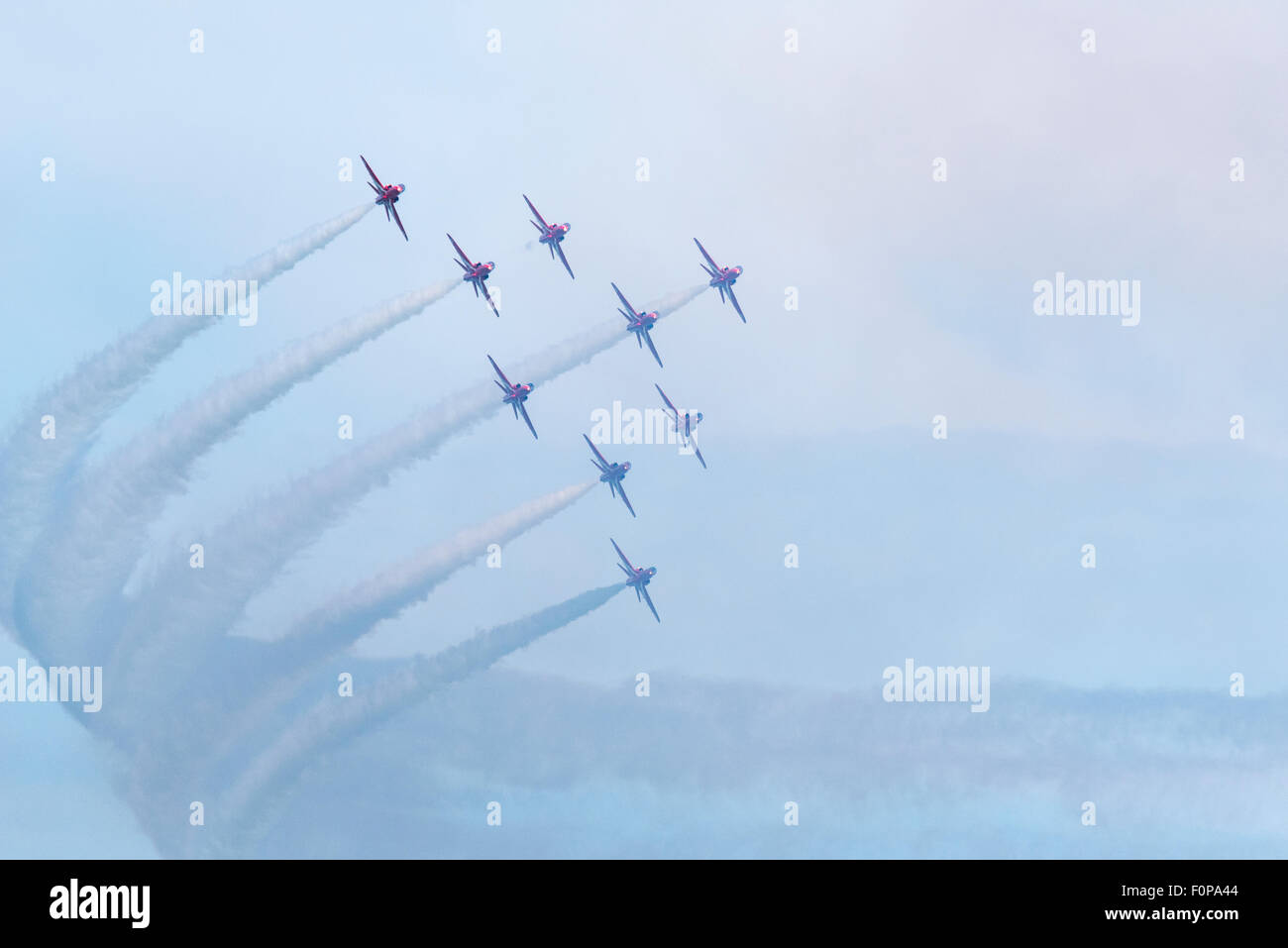 All nine Red Arrows in formation and releasing smoke at Airbourne ...