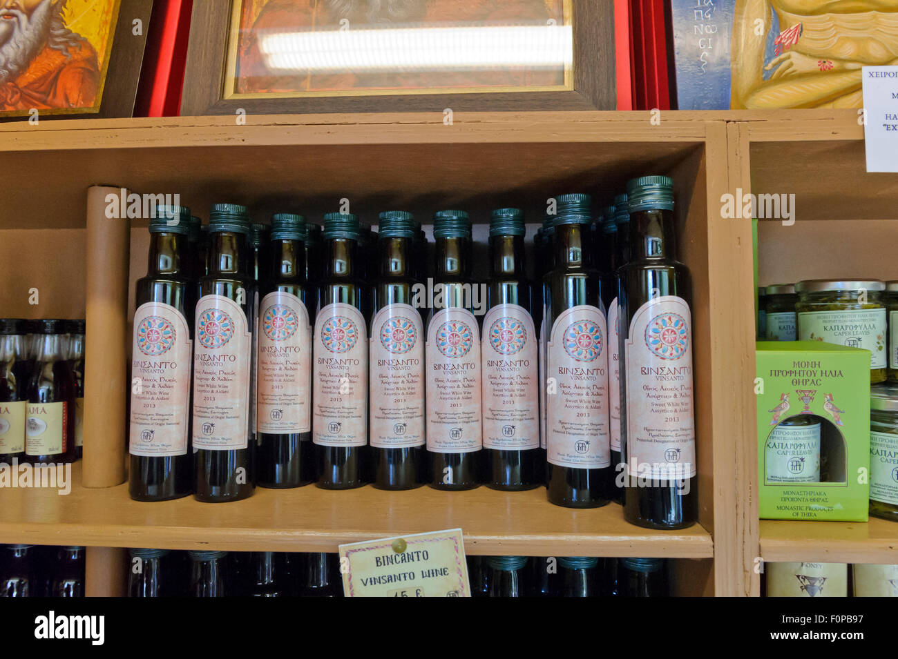 Bottles of wine on shelves for sale in a Monastery shop, Santorini ...