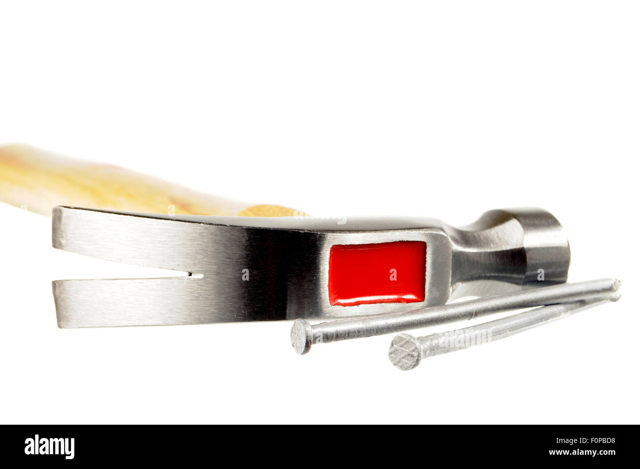 Macro shot of a hammer and nails isolated on a white background Stock ...