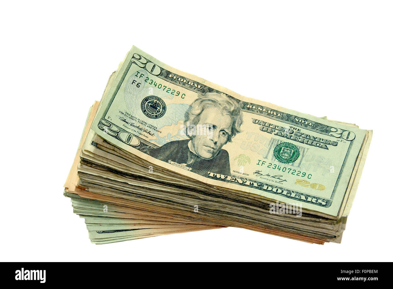 Bunch of dollars bills staked on a pile isolated on white Stock Photo ...