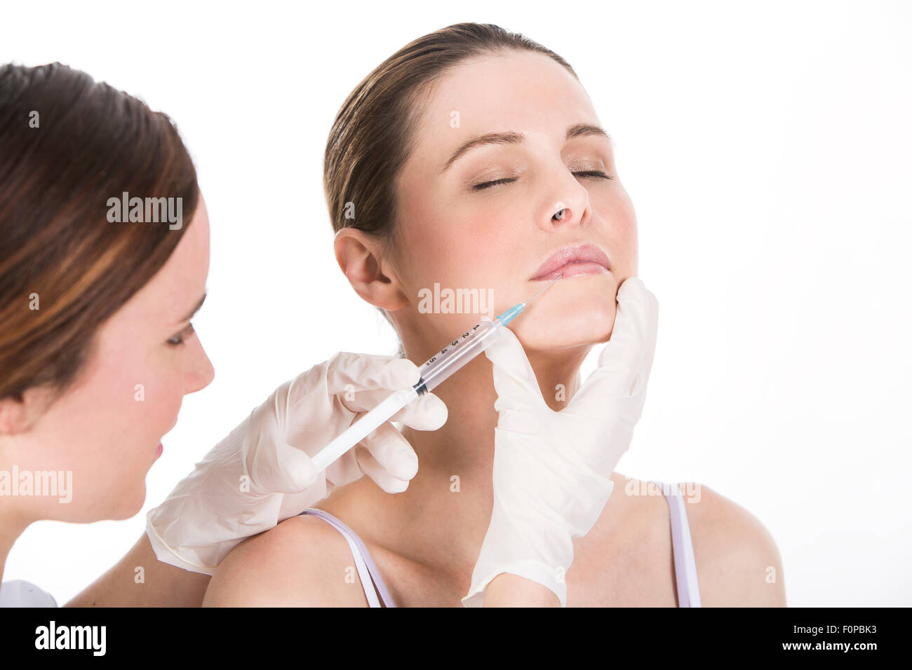 doctor gets botox injection to a woman Stock Photo - Alamy
