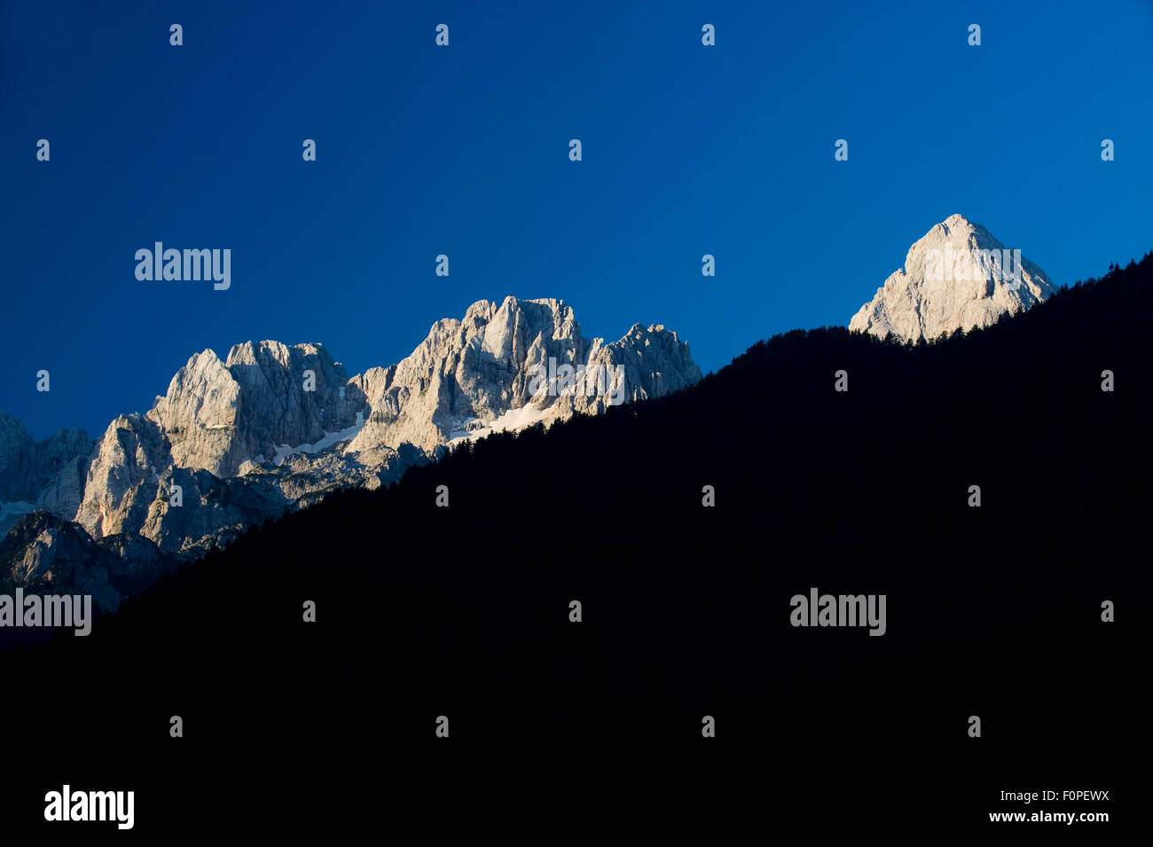 Mount Spik (2,472m) peak on the right, viewed from Gozd-Martuljek ...