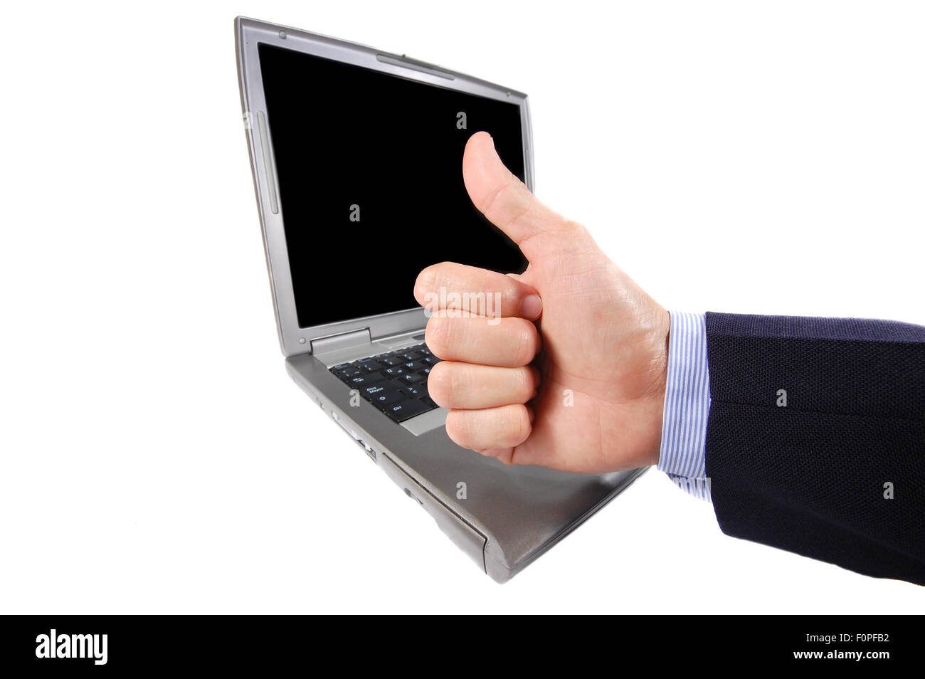 Hand showing the thumb up sign with a laptop on the background Stock ...