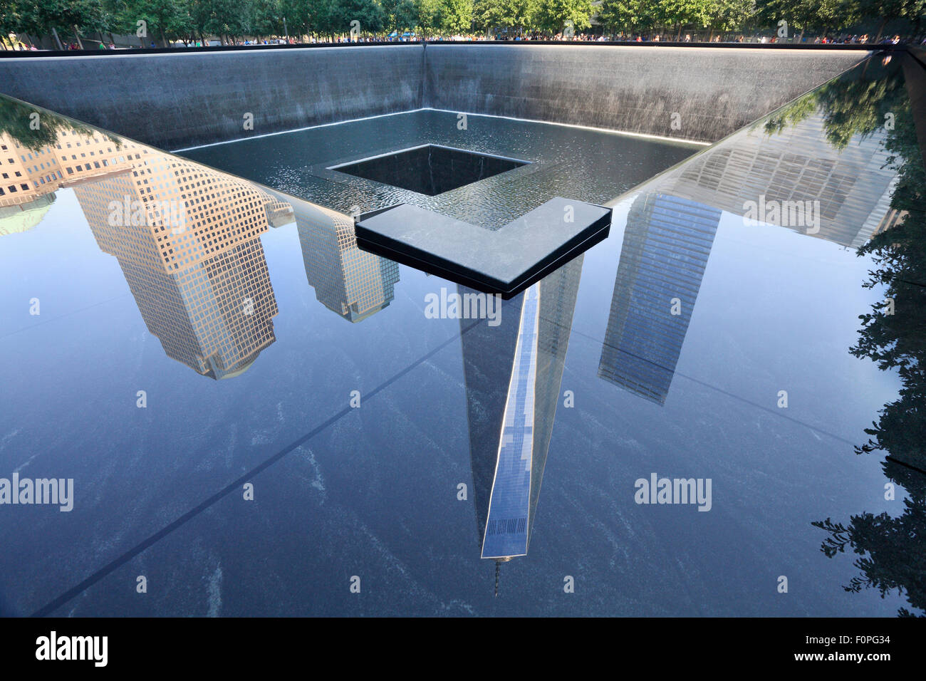 Memorial Fountain and reflections of One World Trade Center on ...
