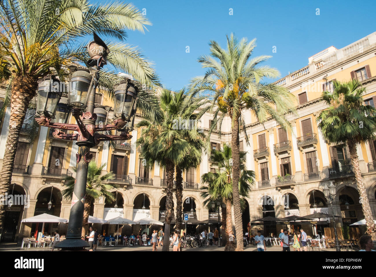 Tourists and fountain in large square, Placa, Reial,Plaza,Real, just ...