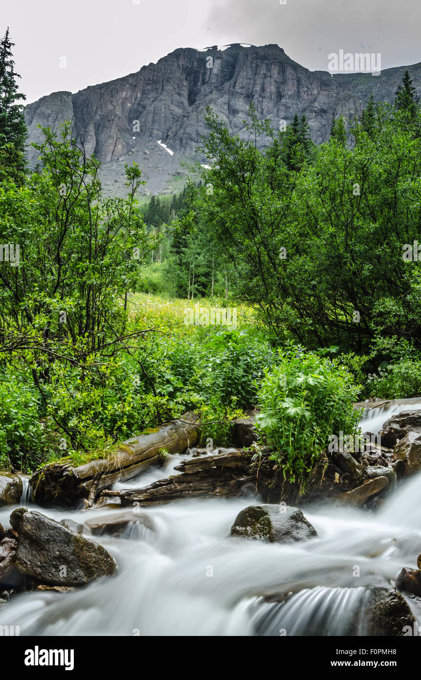A rushing creek in motion high in a Colorado mountain basin Stock Photo ...