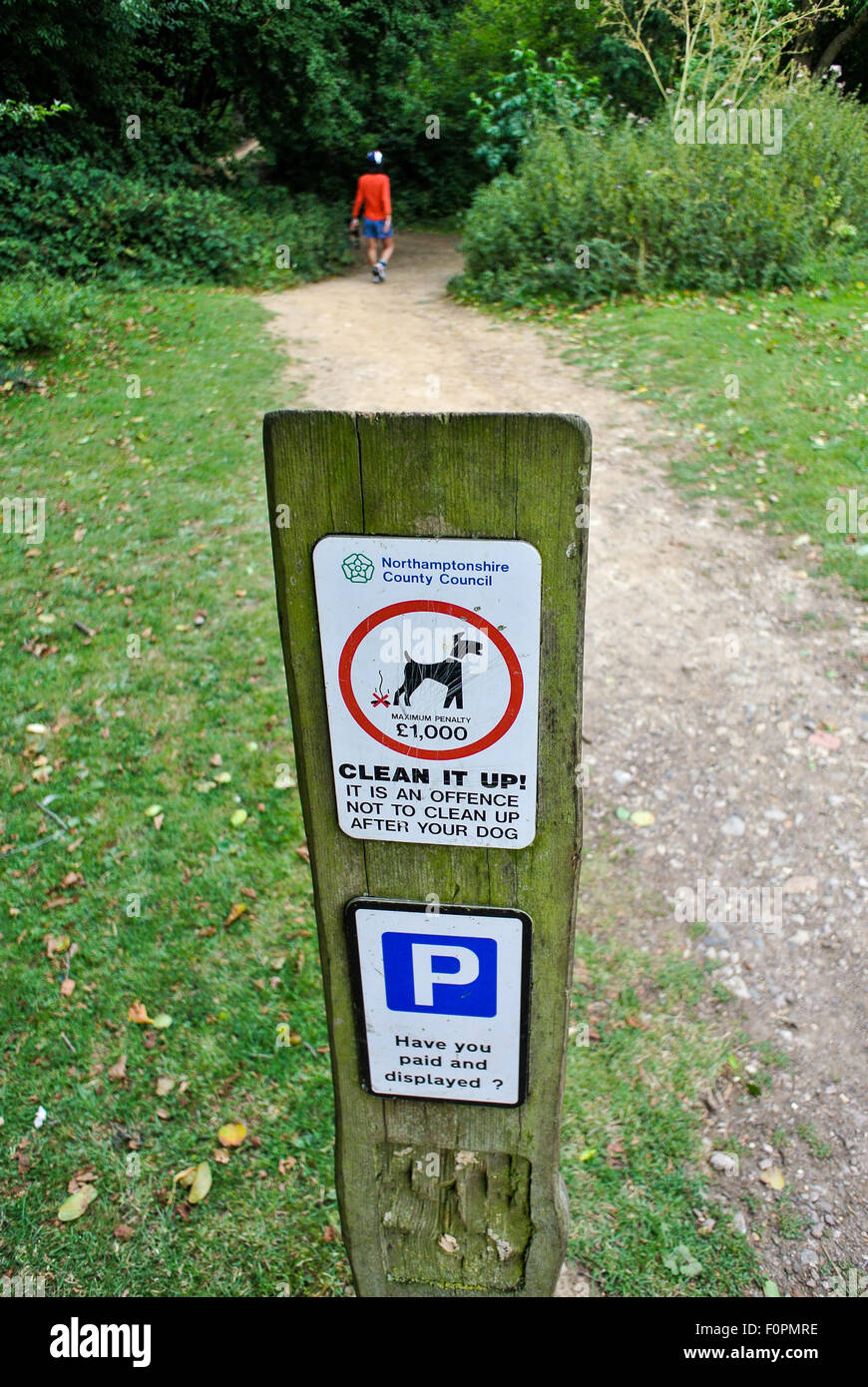 Dog poo mess sign clean it up Stock Photo - Alamy