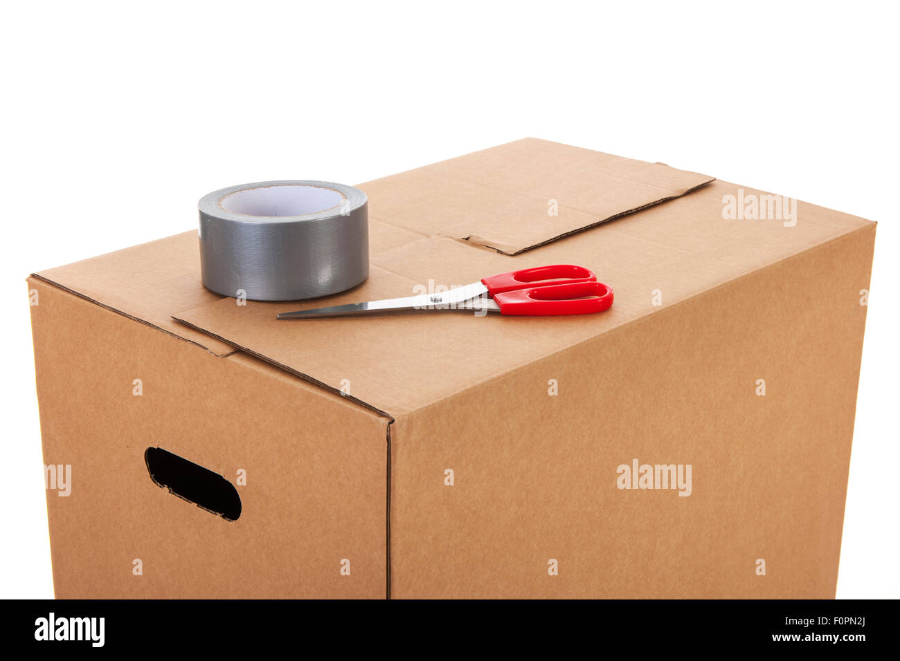 Closed box with scissors and scotch tape isolated over white background ...