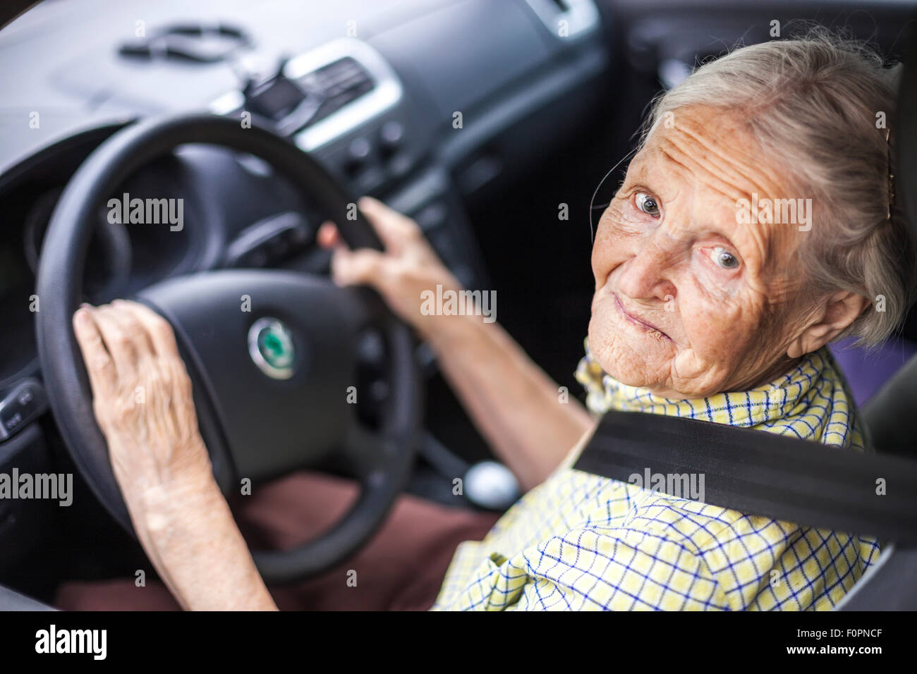 Senior woman driving a car Stock Photo - Alamy