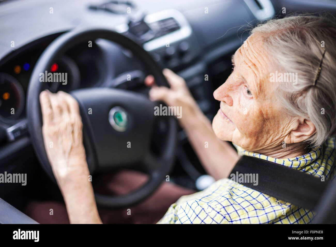Senior woman driving a car Stock Photo - Alamy
