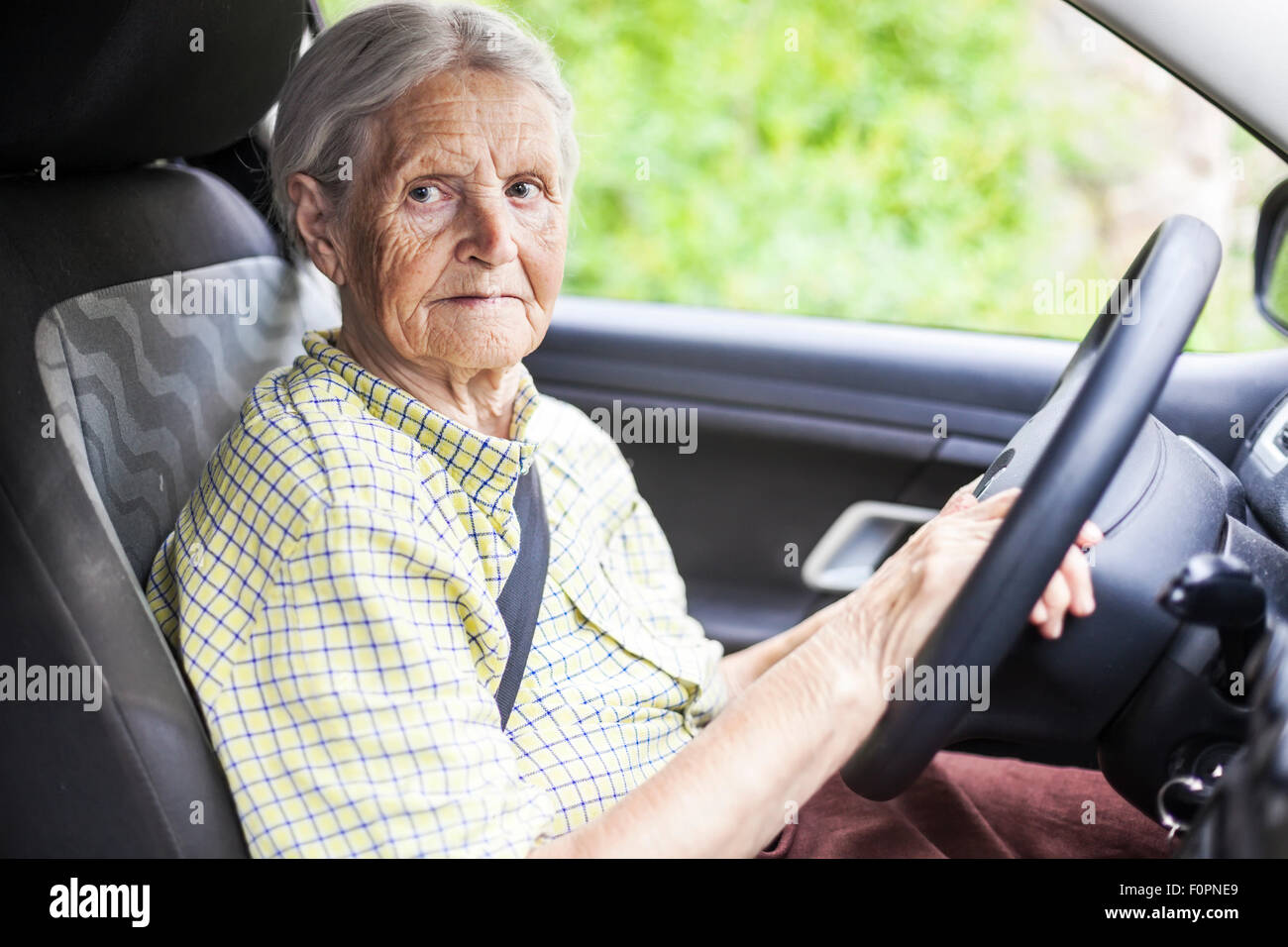 Senior woman driving a car Stock Photo - Alamy