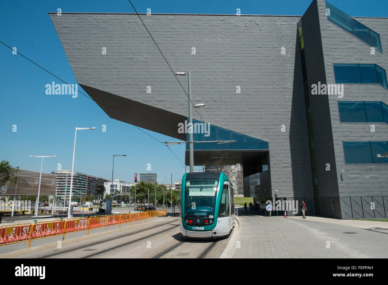 Tram and Design Disseny Museum in Barcelona,Spain. With Agbar Tower in ...