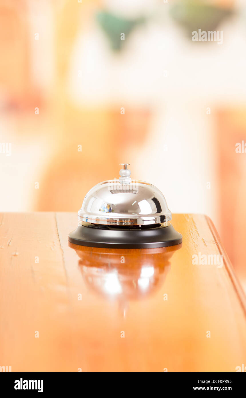 hotel bell in reception desk close up selective focus Stock Photo - Alamy