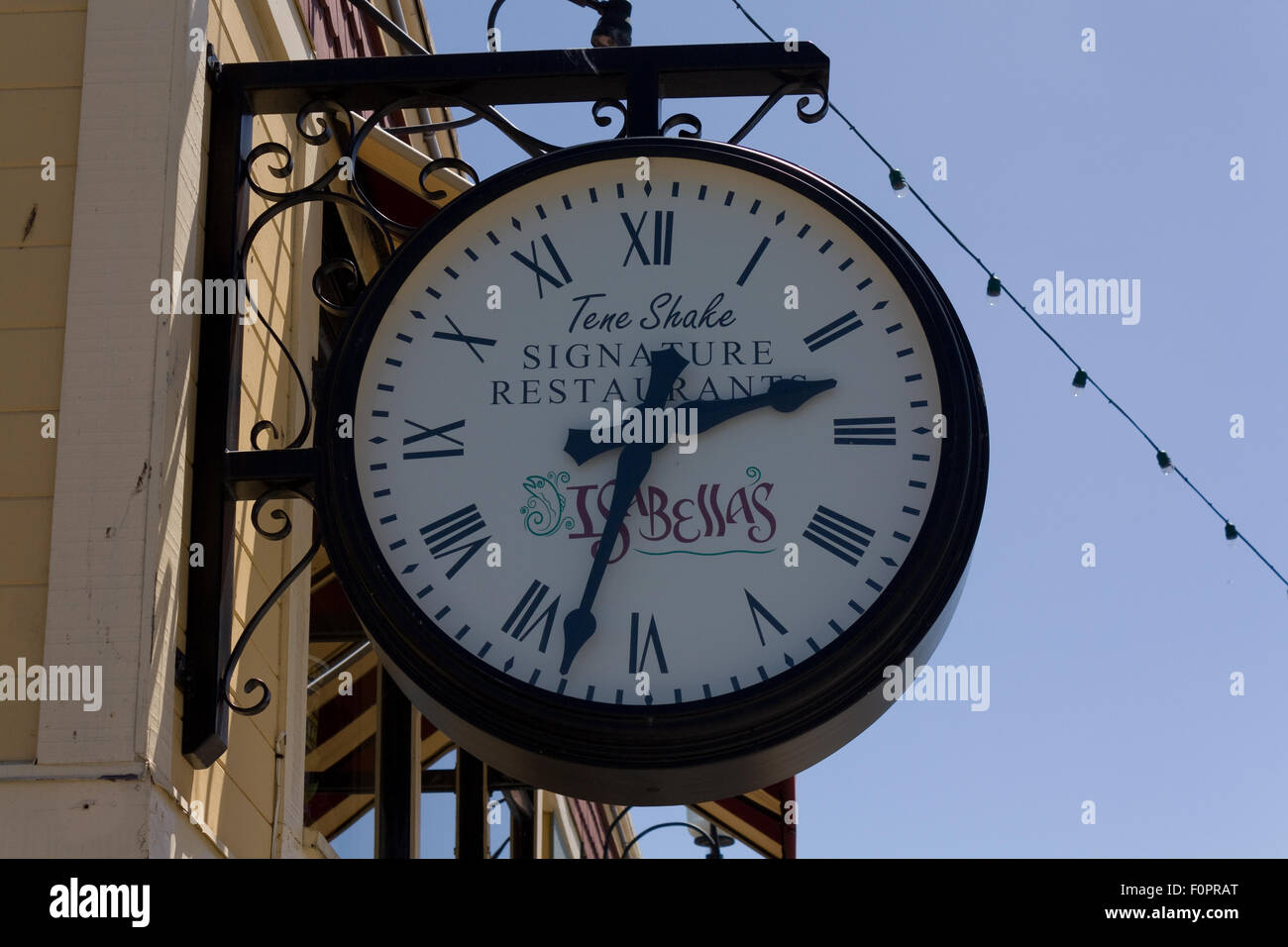 Large clock over restaurant Stock Photo - Alamy