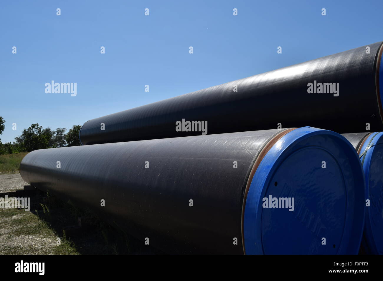 The gas pipeline, pipes prior to assembly. A warehouse of pipes before ...