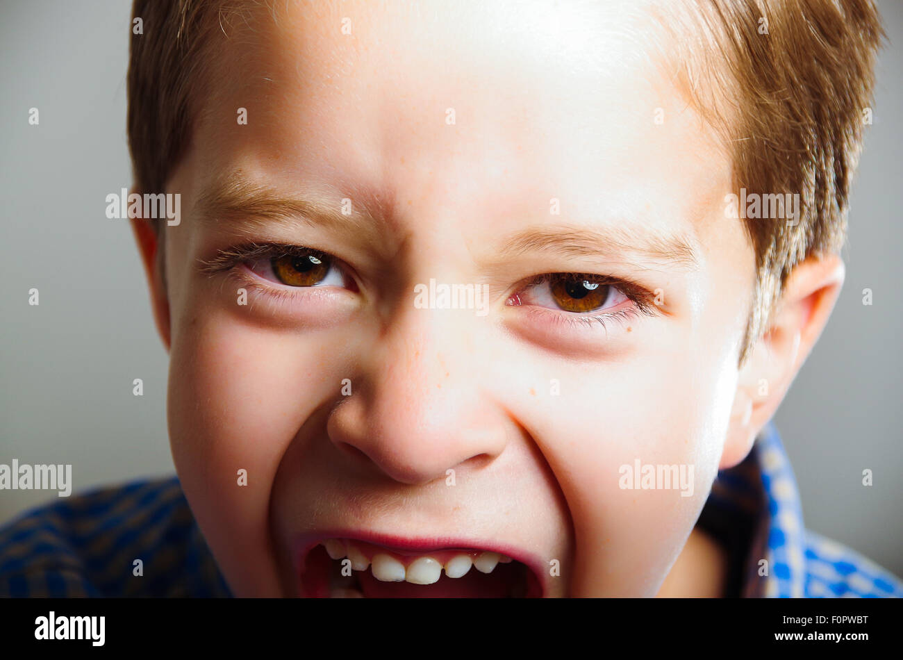 Cute little boy screaming Stock Photo - Alamy