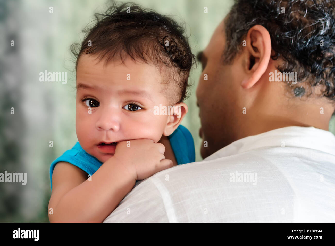 Portrait of a happy family, Bengali father with sweet little son ...