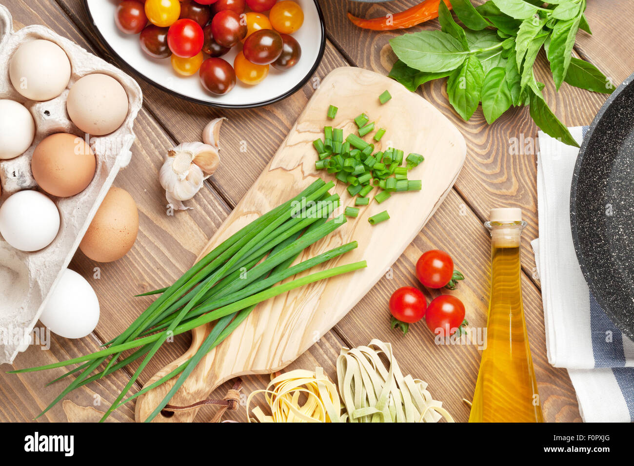 Pasta cooking ingredients and utensils on wooden table. Top view Stock ...