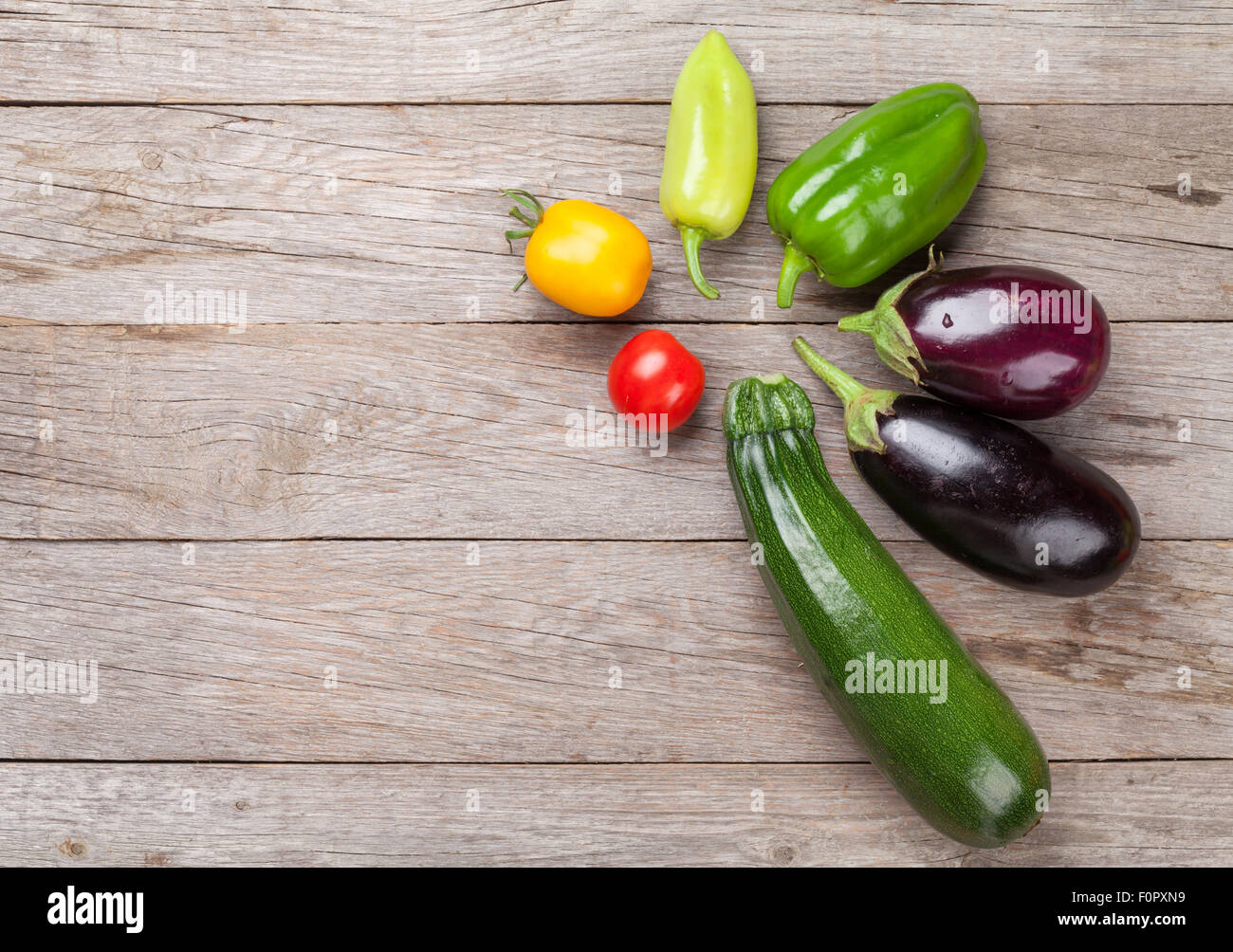 Fresh farmers garden vegetables on wooden table. Top view with copy ...