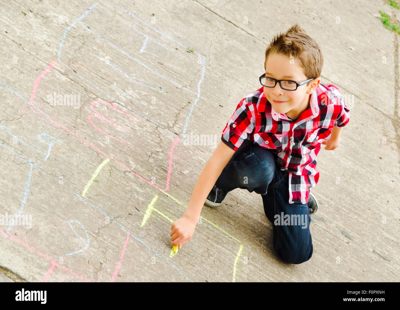 cute boy playing hopscotch Stock Photo - Alamy