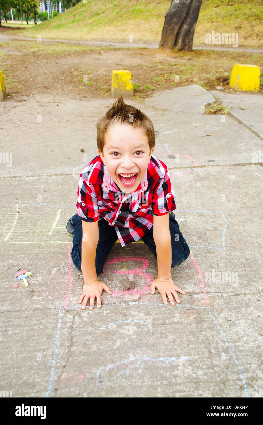 cute boy playing hopscotch Stock Photo - Alamy
