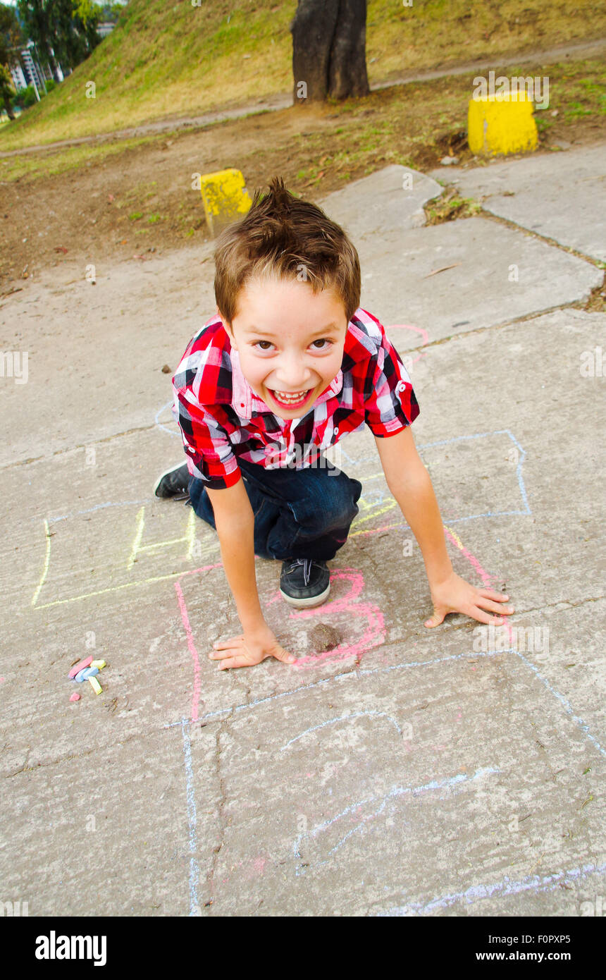 cute boy playing hopscotch Stock Photo - Alamy