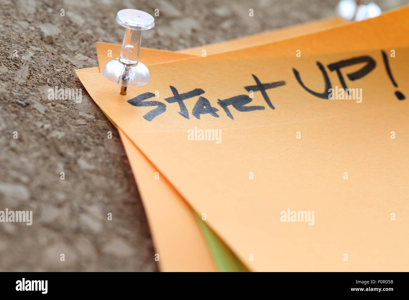 close up of pin and hand drawn business strategy graph chart on sticky ...