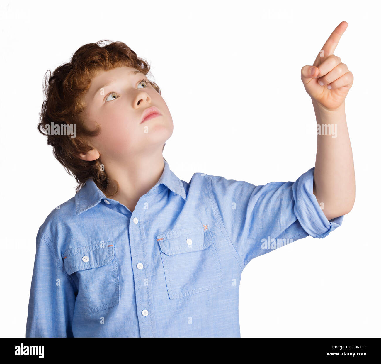 Handsome boy points with his finger. Isolated on white background Stock ...