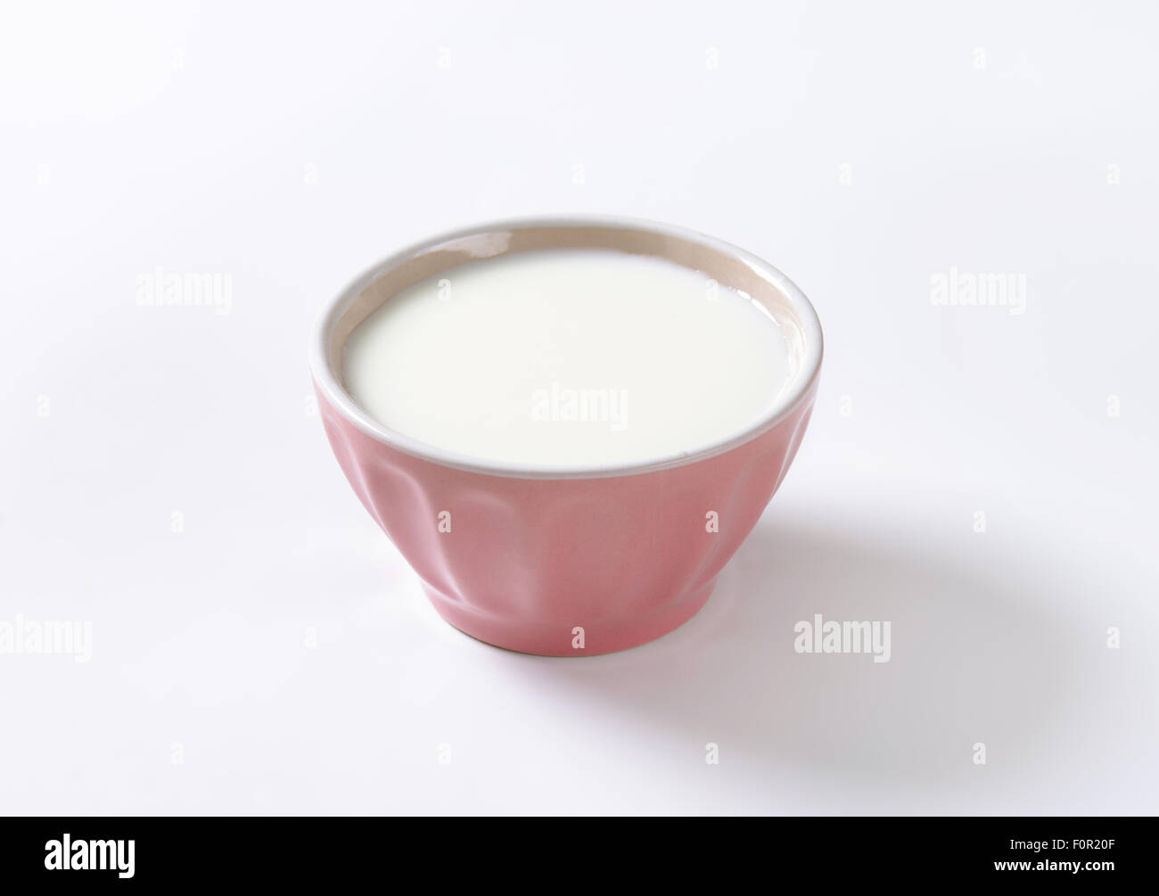 bowl of milk on white background Stock Photo - Alamy