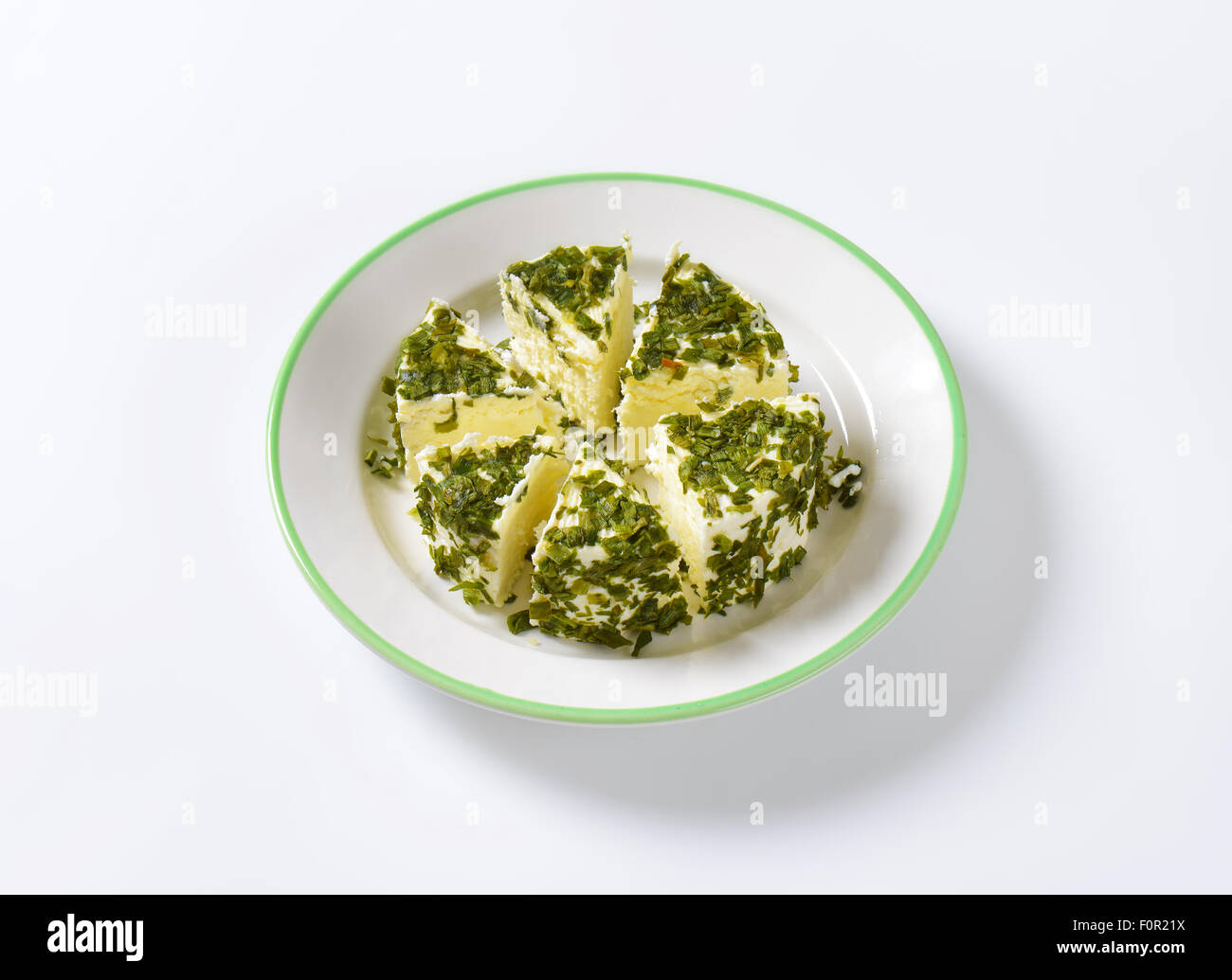 fresh cheese coated in chives and garlic Stock Photo - Alamy