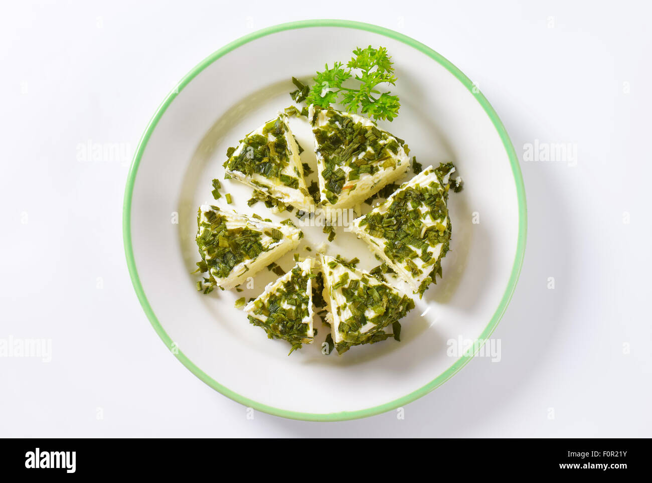 fresh cheese coated in chives and garlic Stock Photo - Alamy