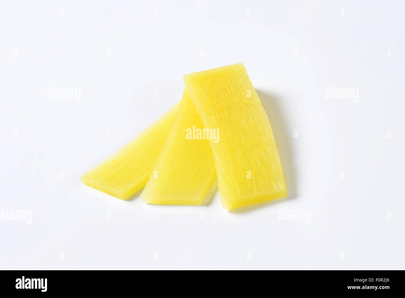 three bamboo shoot slices on white background Stock Photo - Alamy