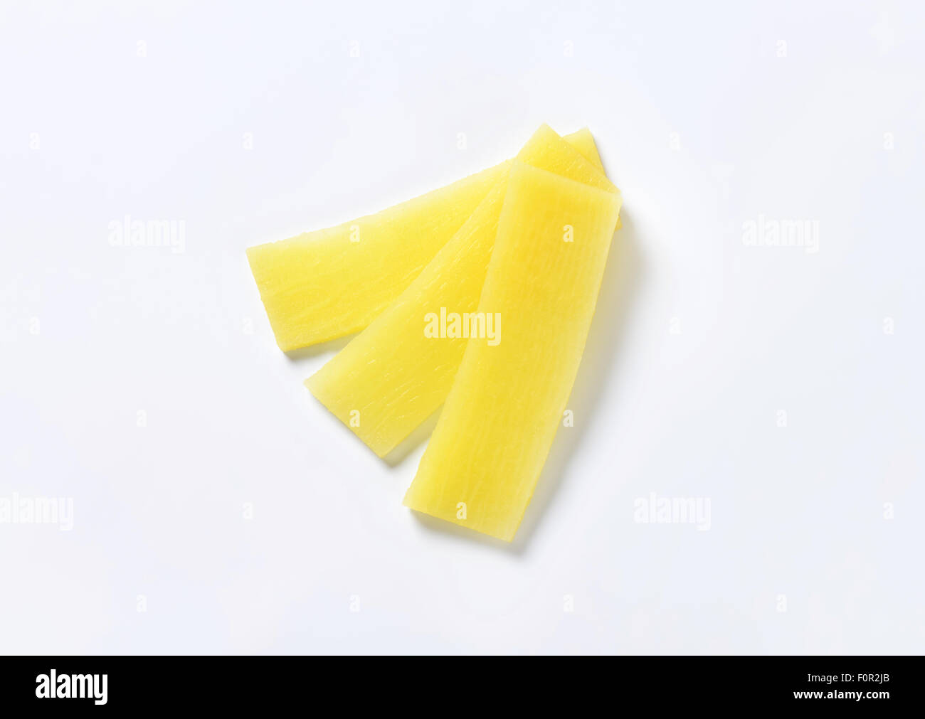 three bamboo shoot slices on white background Stock Photo - Alamy