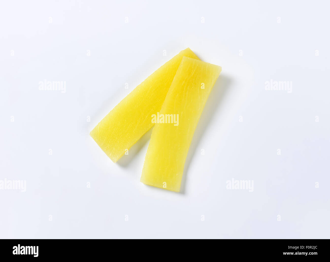 two bamboo shoot slices on white background Stock Photo - Alamy