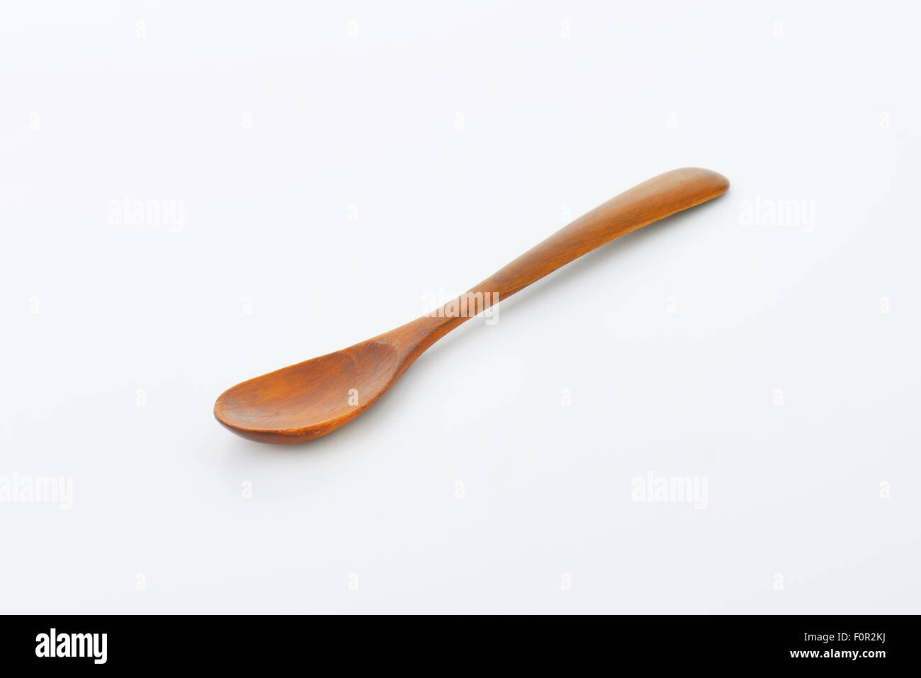 Small rustic natural wood spoon Stock Photo - Alamy
