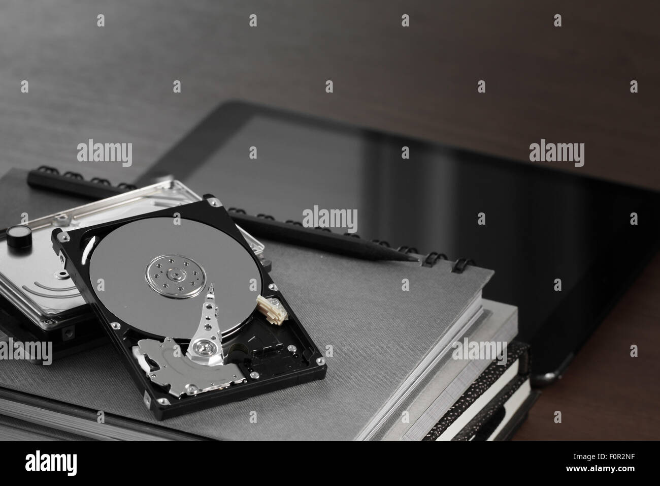 Close up of open computer hard disk drive with social network diagram ...
