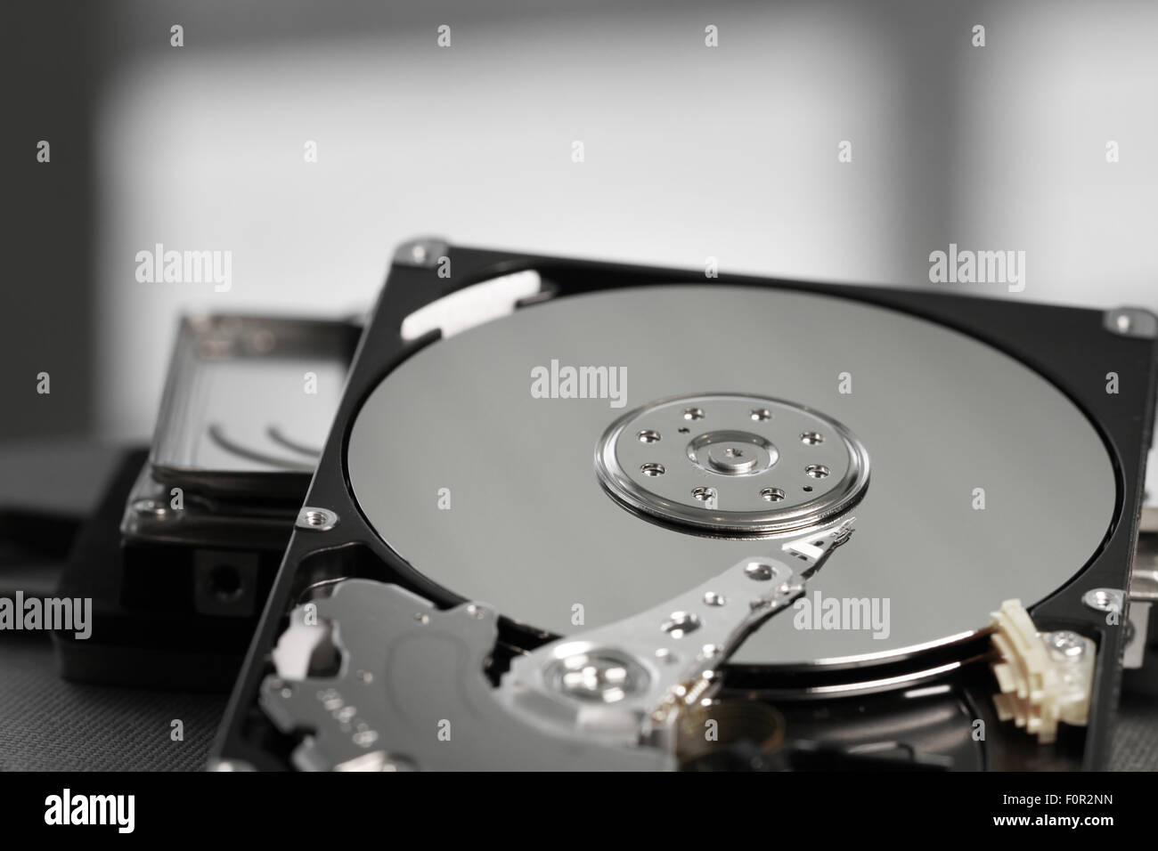 Close up of open computer hard disk drive with social network diagram ...