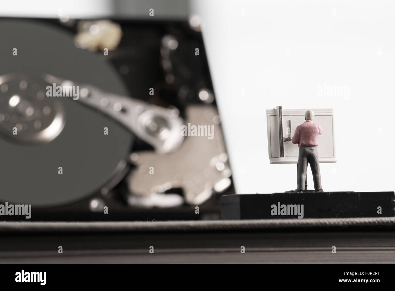 Close up of open computer hard disk drive with social network diagram ...