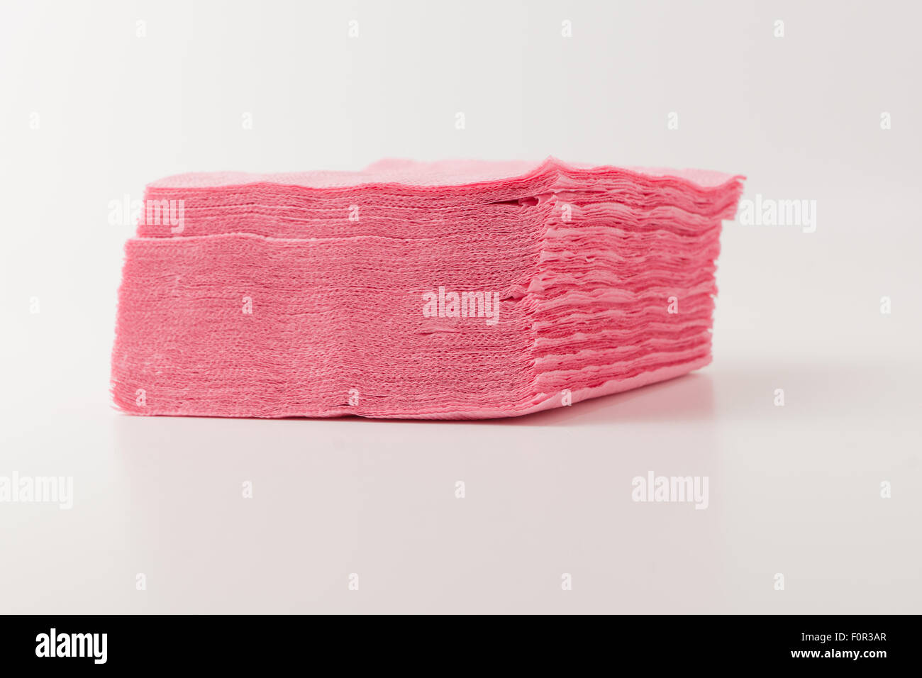 pile of pink tissues on a white background Stock Photo - Alamy