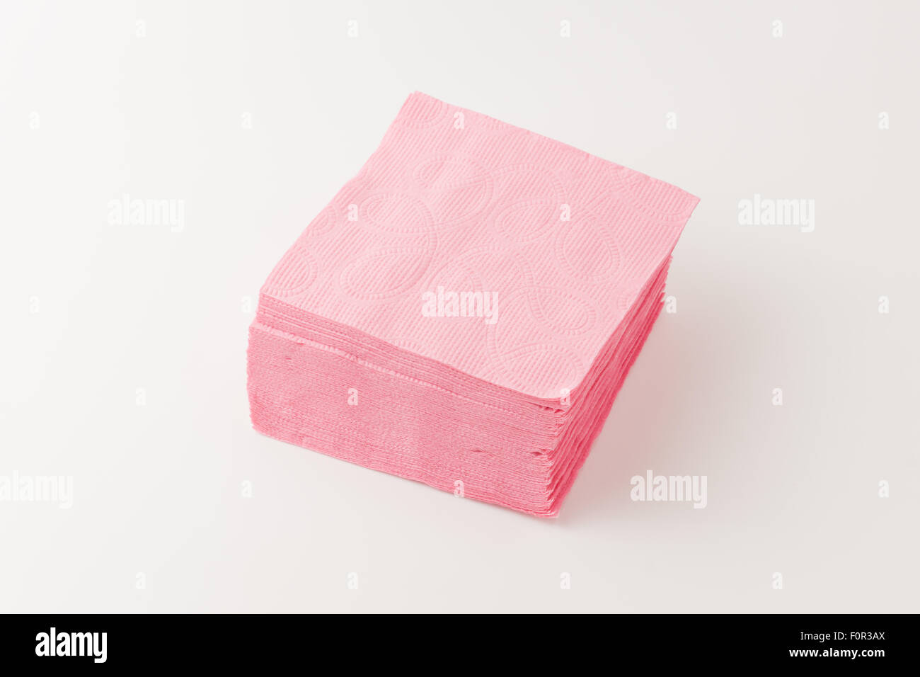 pile of pink tissues on a white background Stock Photo - Alamy