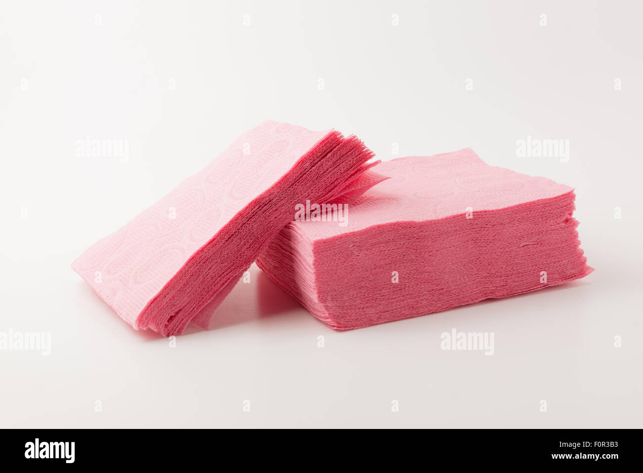 pile of pink tissues on a white background Stock Photo - Alamy