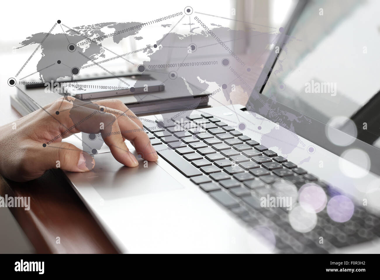 Close up of business man hand working on blank screen laptop computer ...