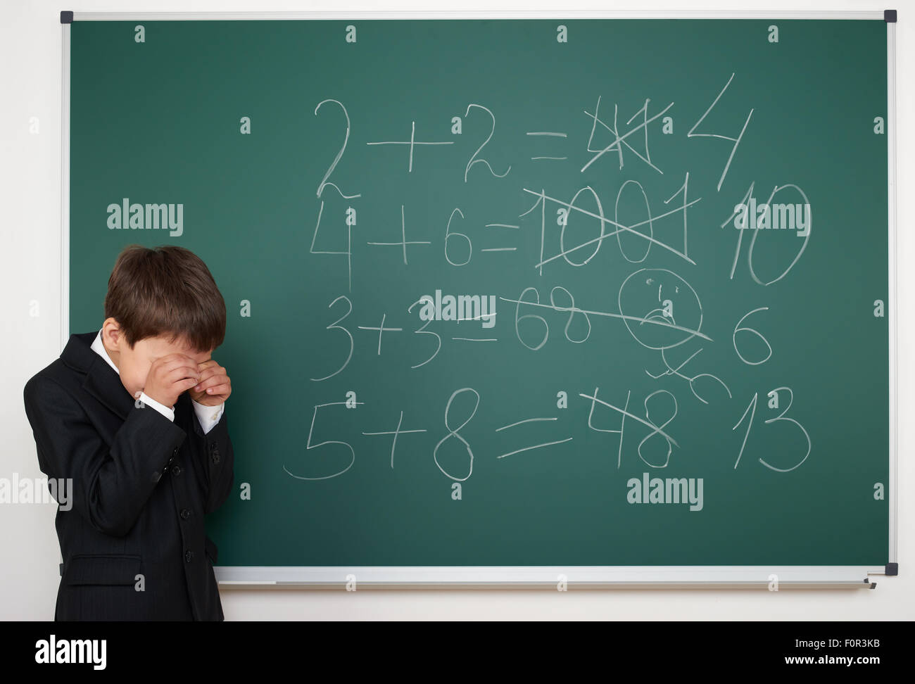 School boy solve math on the school board Stock Photo - Alamy