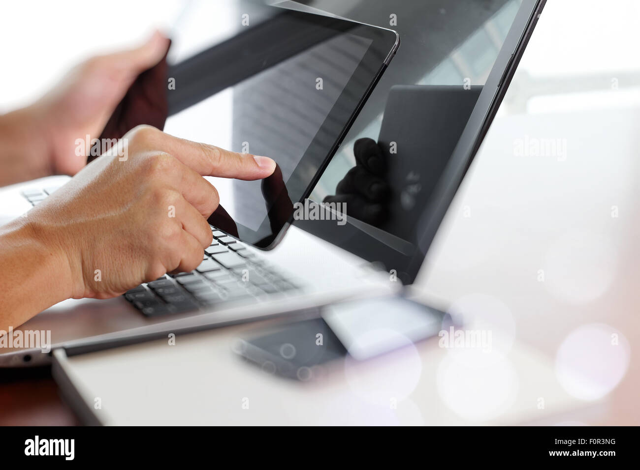 Close up of business man hand working on blank screen laptop computer ...