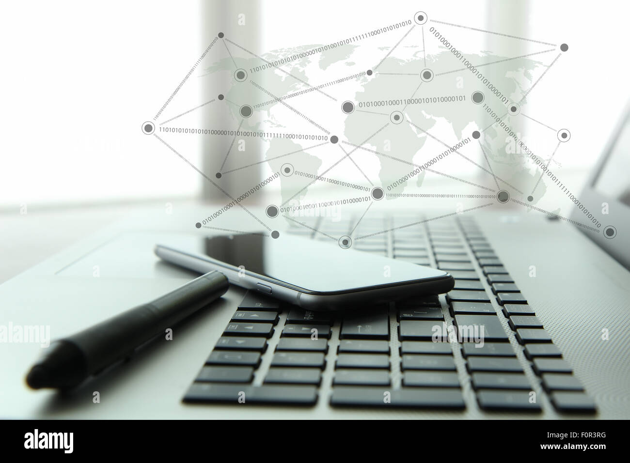 Businessman hand using laptop and mobile phone in office Stock Photo ...